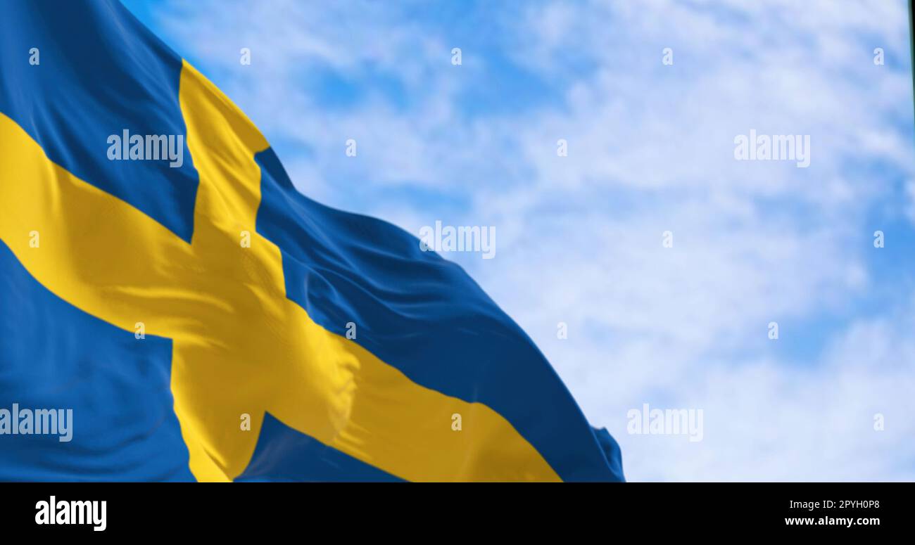 The national flag of Sweden waving on a clear day Stock Photo - Alamy