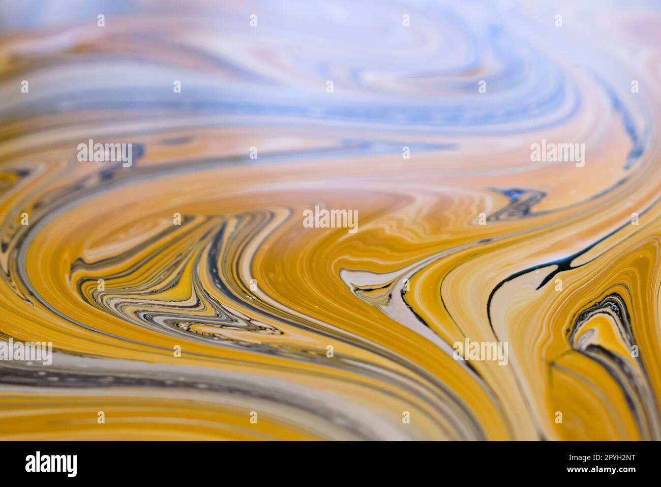 Colorful swirls of ochre paint. Abstract background Stock Photo - Alamy