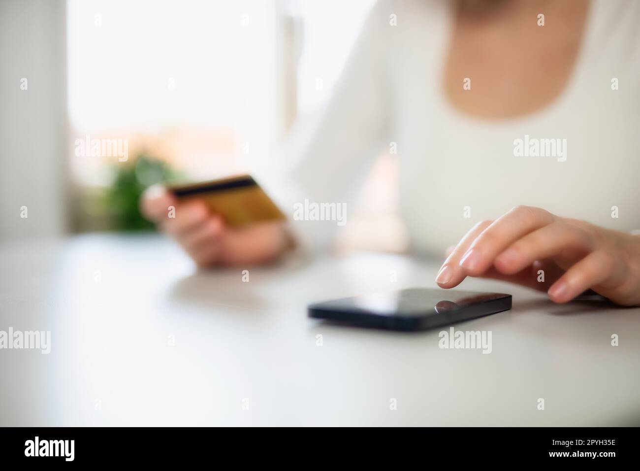 Woman holding credit card sitting hi-res stock photography and images ...
