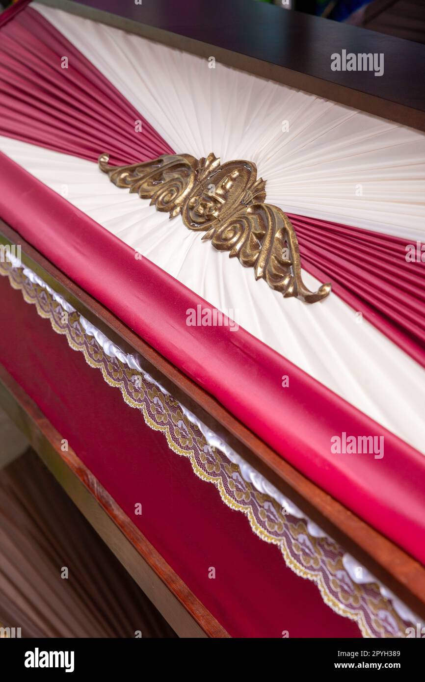 The lid of the coffin, covered with fabric. The coffin is made of ...