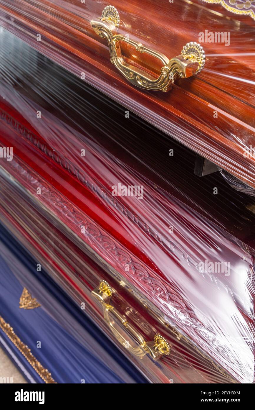 Interior of room with funeral accessories. Shop selling coffins ...