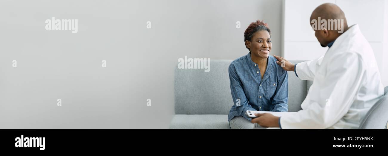 Doctor Talking With Elderly African Patient Stock Photo - Alamy