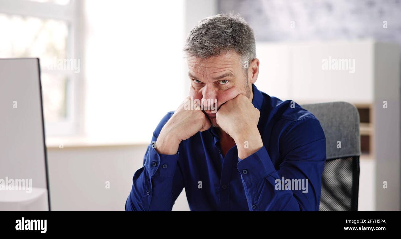 Bored Tired Employee Using Computer Stock Photo - Alamy