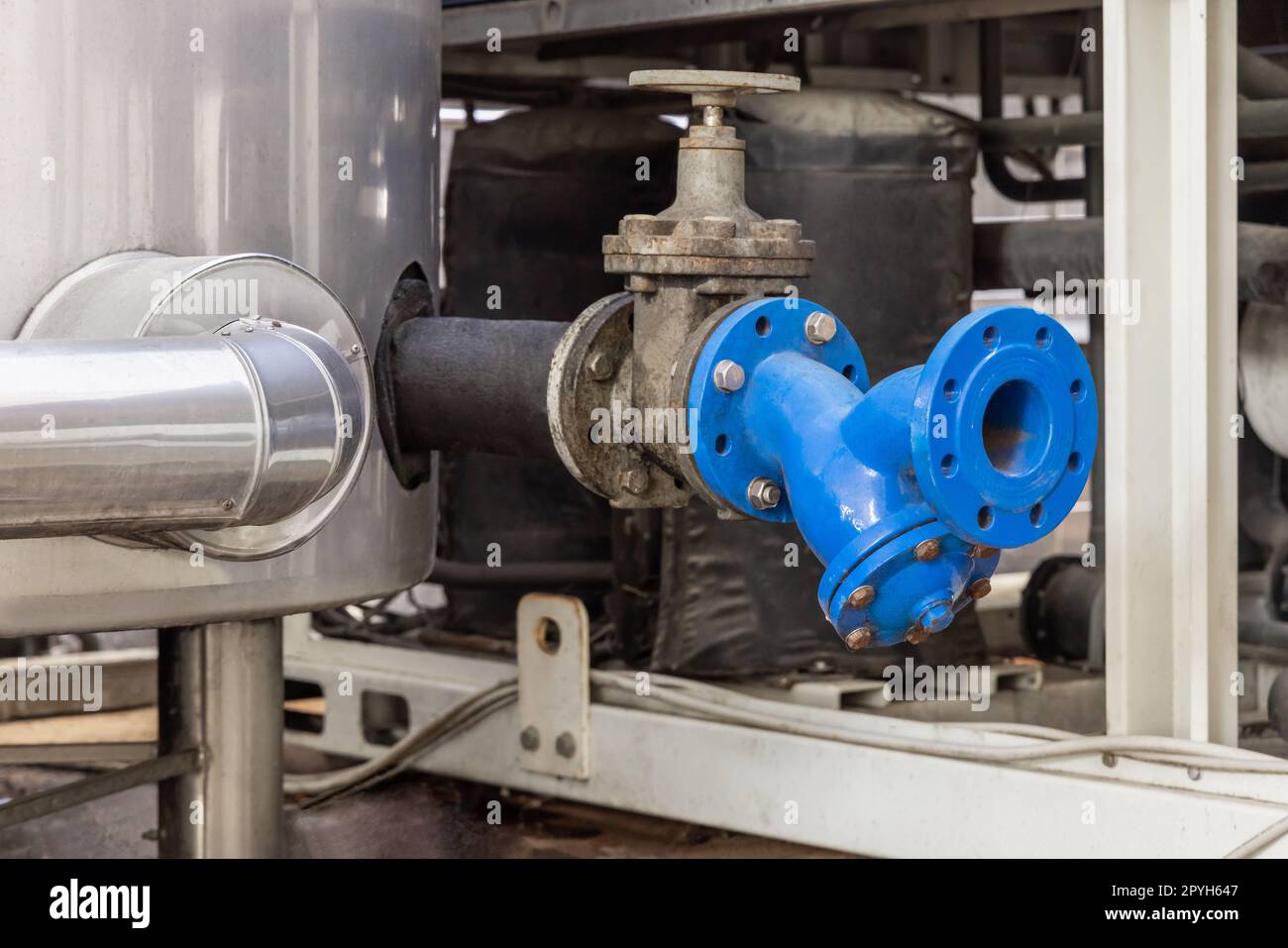 Handwheel type blue metal valve and pipes, industrial equipment at wine ...