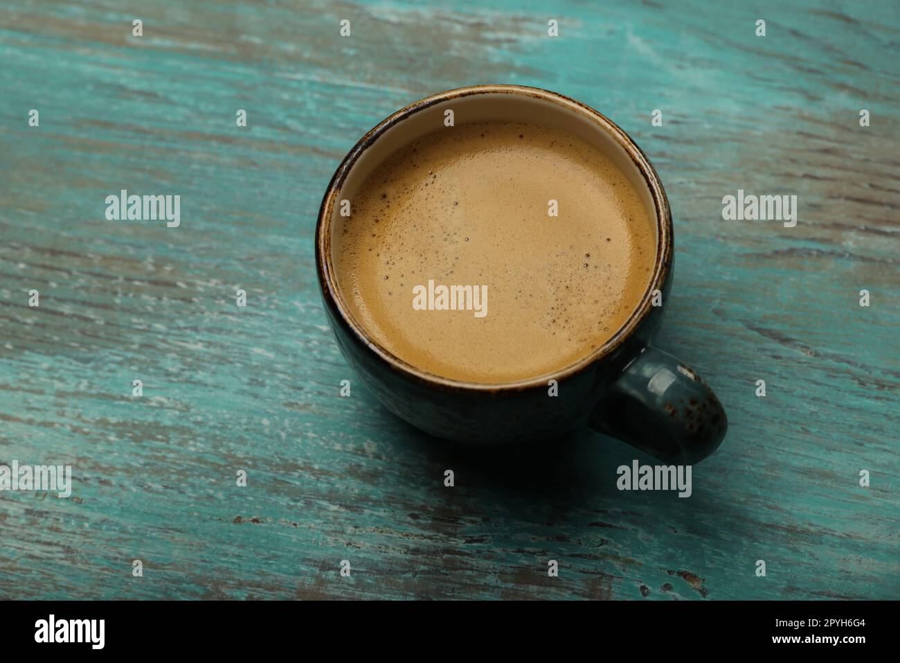 Espresso coffee cup on grunge blue table surface Stock Photo - Alamy