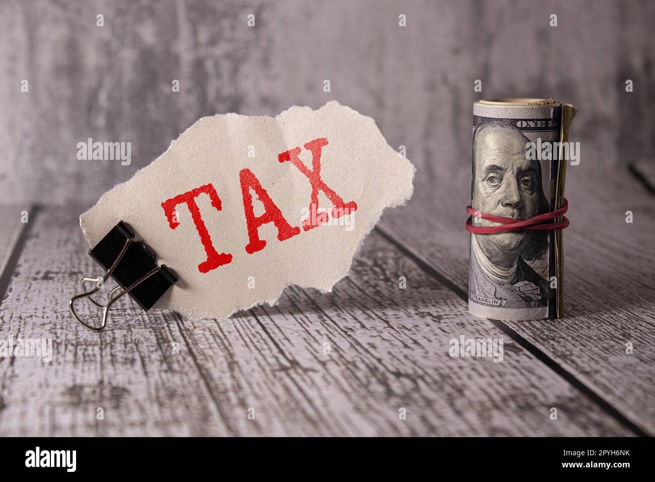 The word tax on a wooden block Business and tax ideas. Taxation. New ...