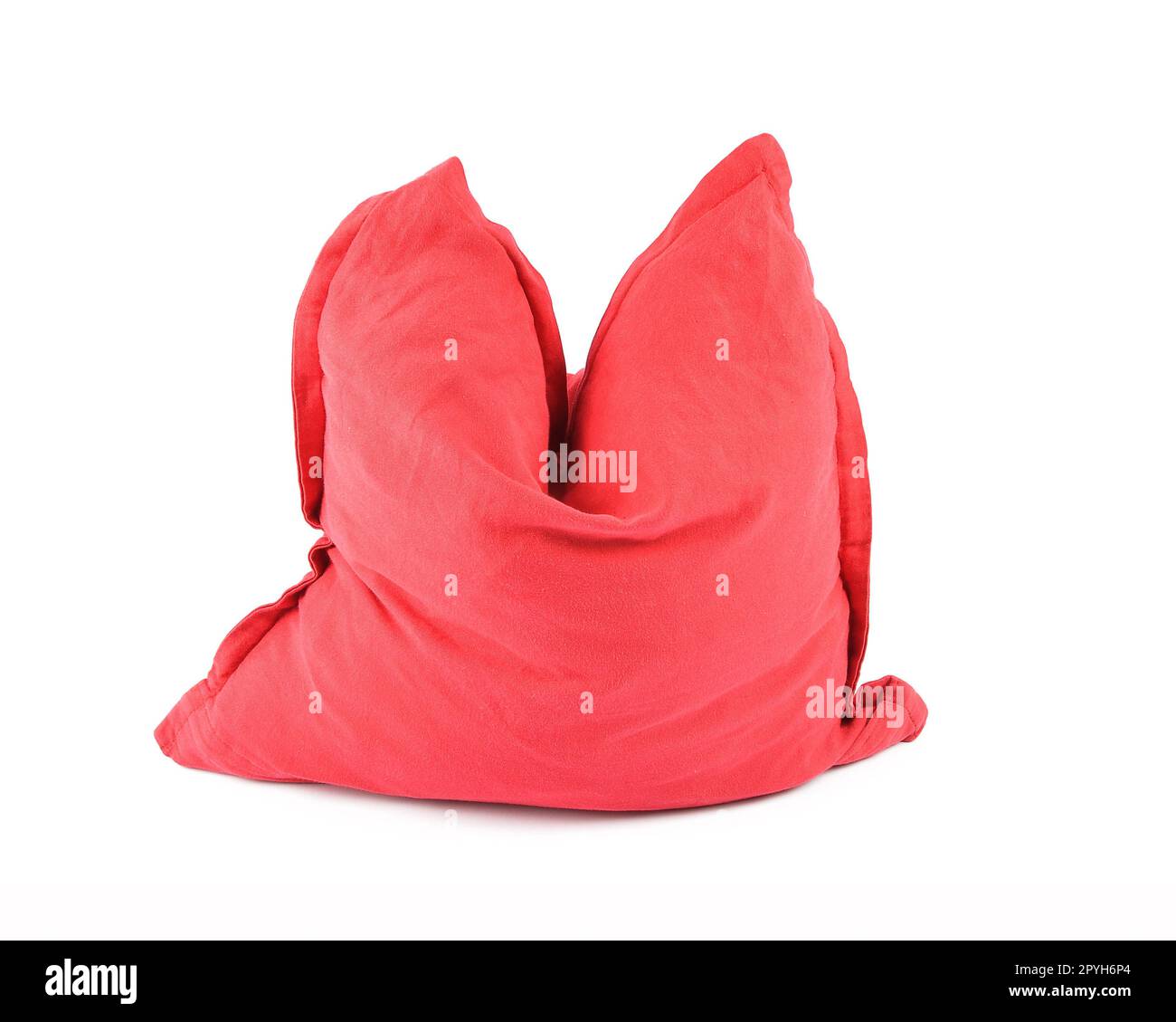 Small red pillow on a white background Stock Photo - Alamy