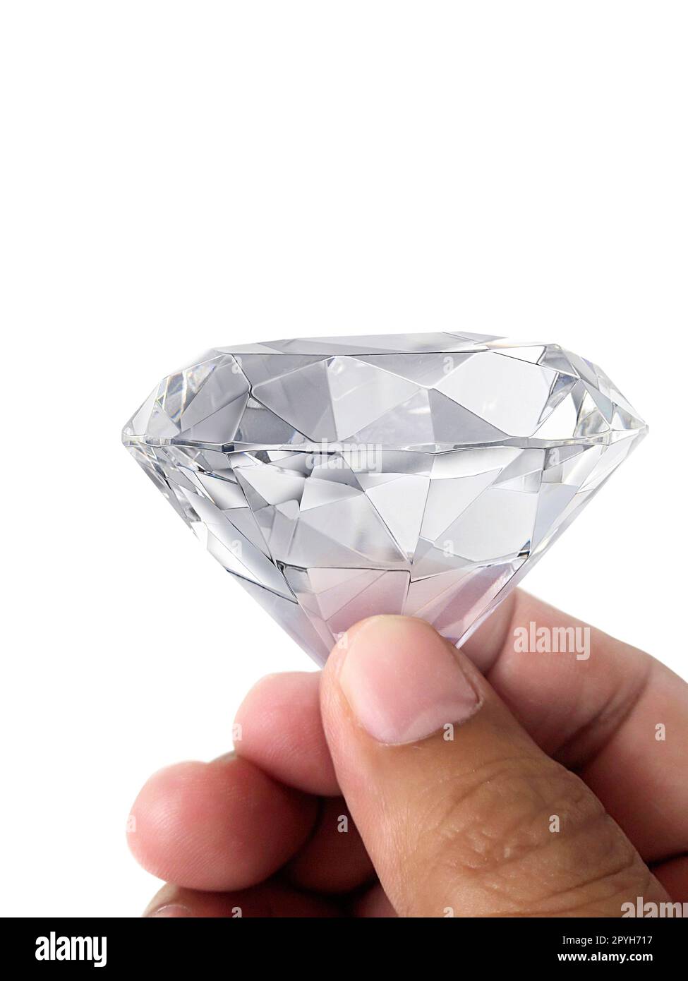 Diamond jewel in hand, isolated on white background Stock Photo - Alamy