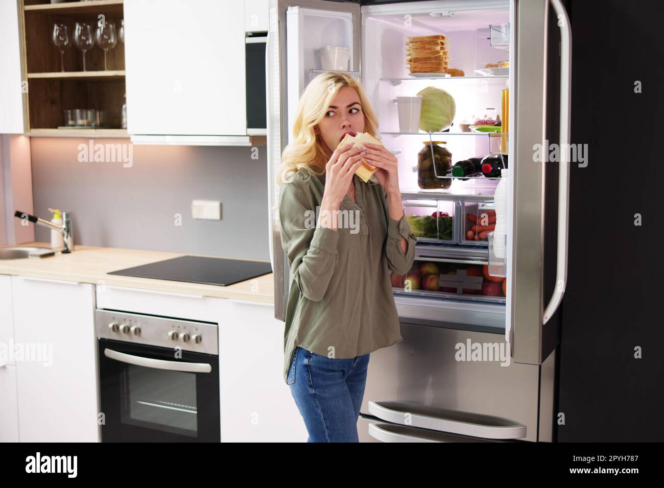 Hungry Woman Eating Cheese Sandwich Stock Photo - Alamy