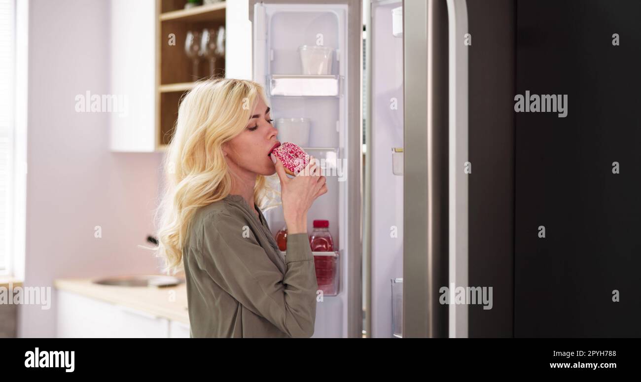 Girl eating a donut hi-res stock photography and images - Alamy