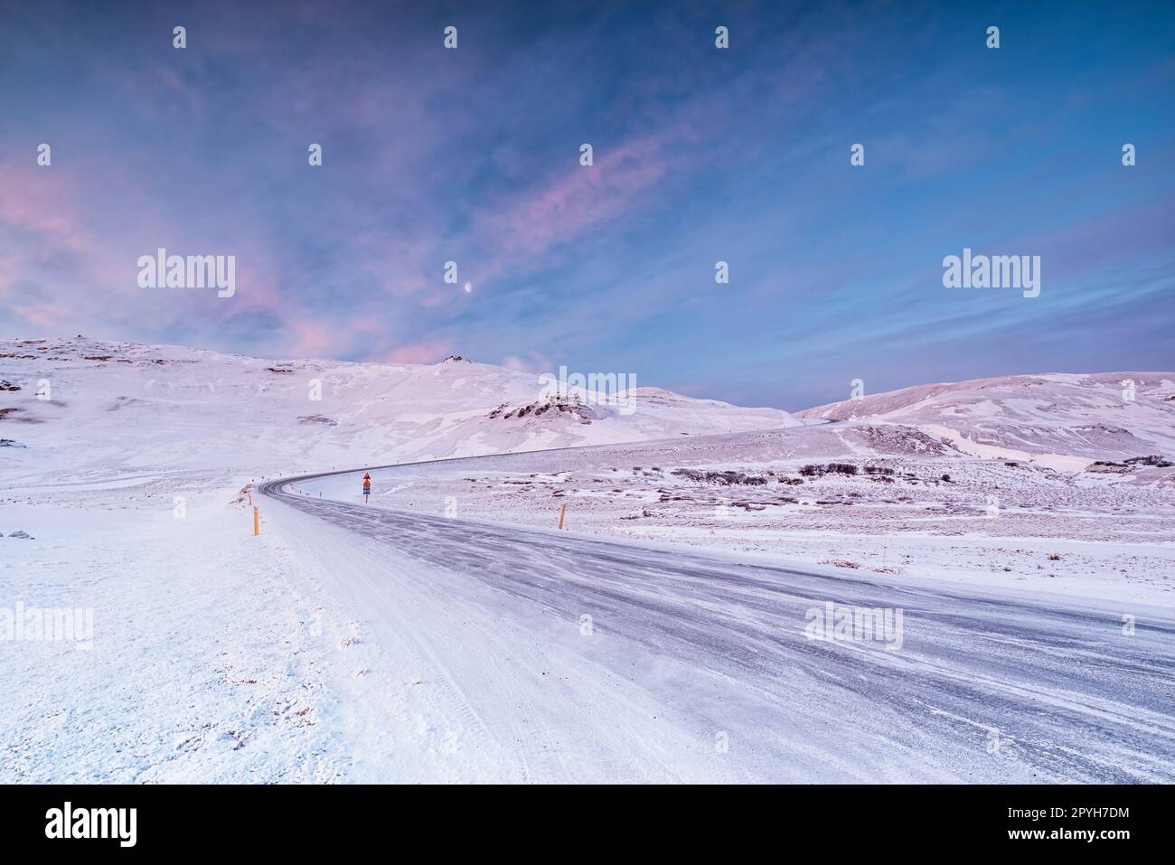 Hverir iced road in winter and moon, Iceland Stock Photo - Alamy