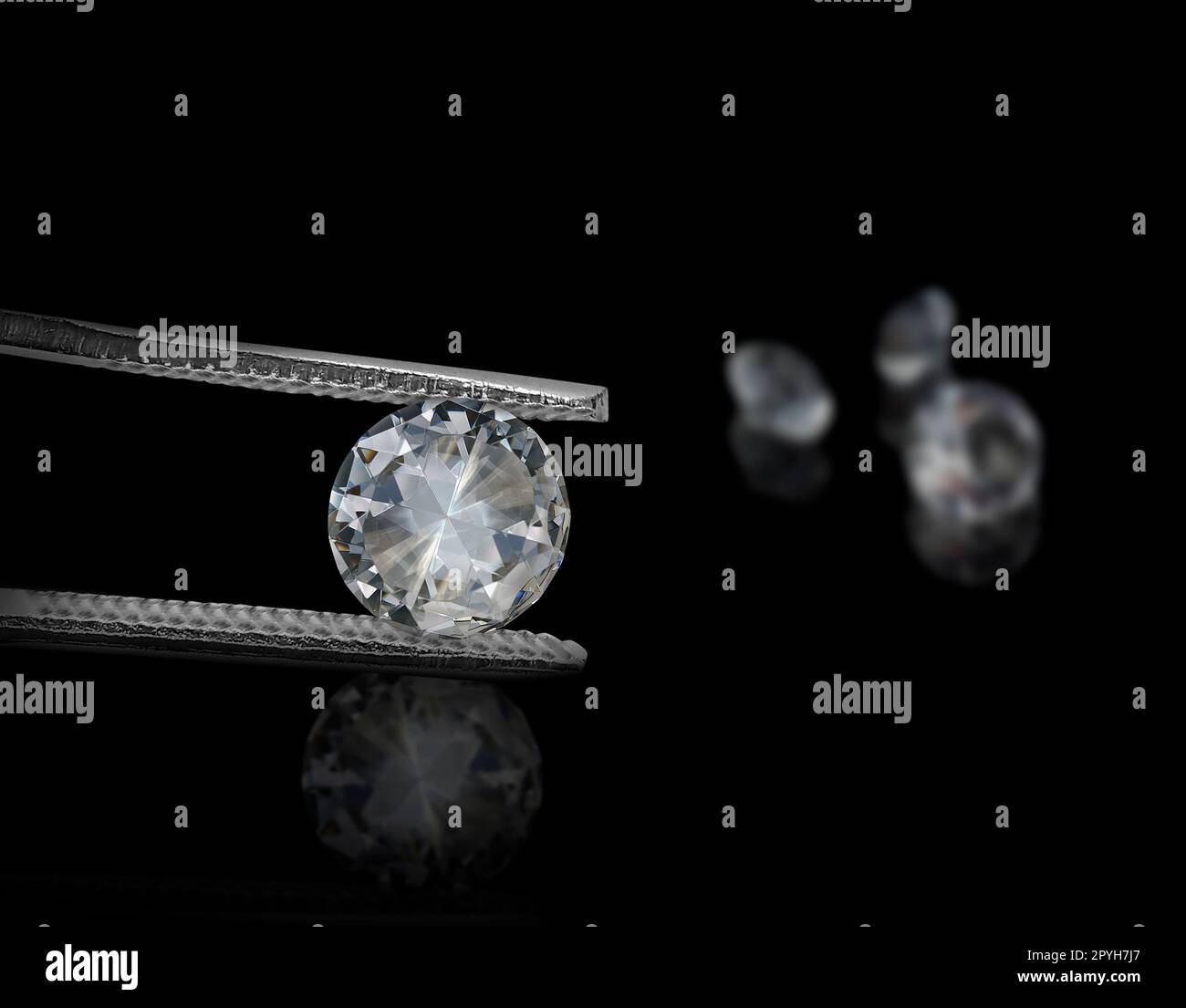 Diamond in tweezers on a black background with diamonds group soft ...
