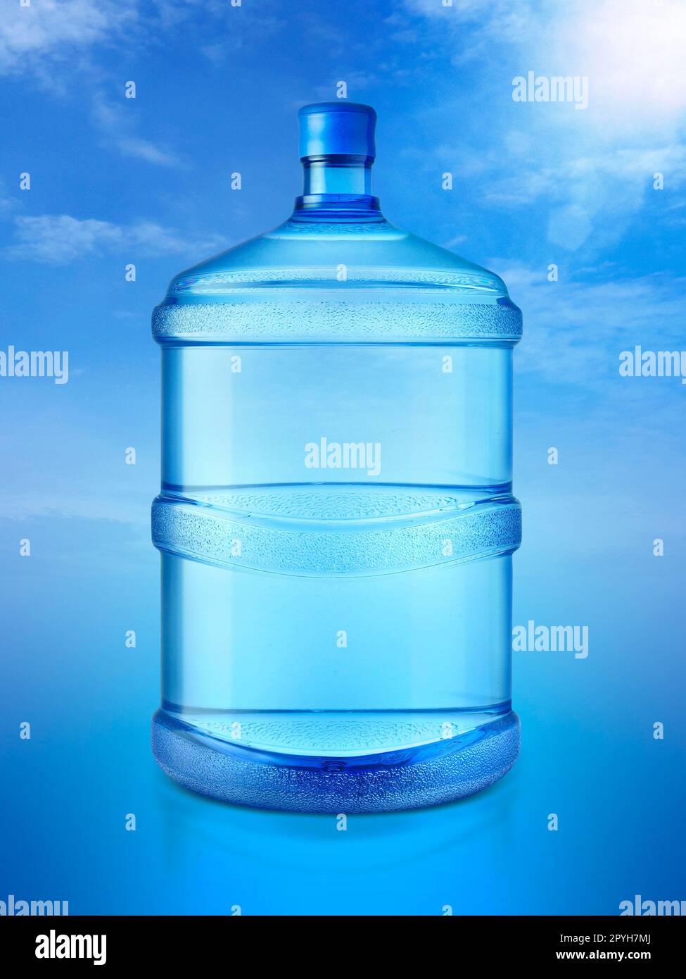 A large bottle of pure with Blue Sky Background Stock Photo - Alamy