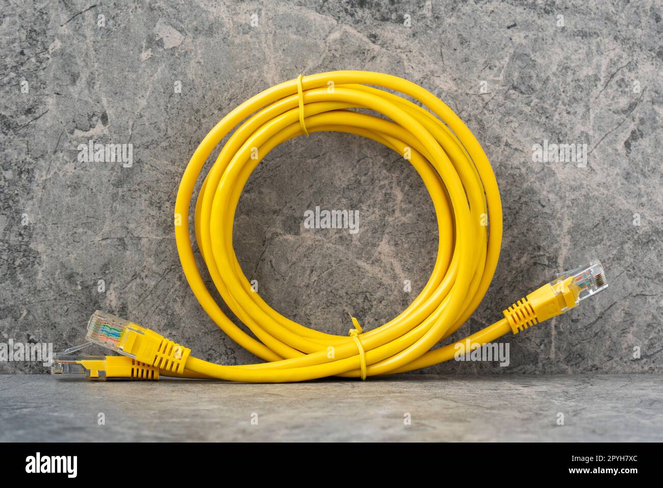 Internet cables RJ45 on the stone background Stock Photo - Alamy