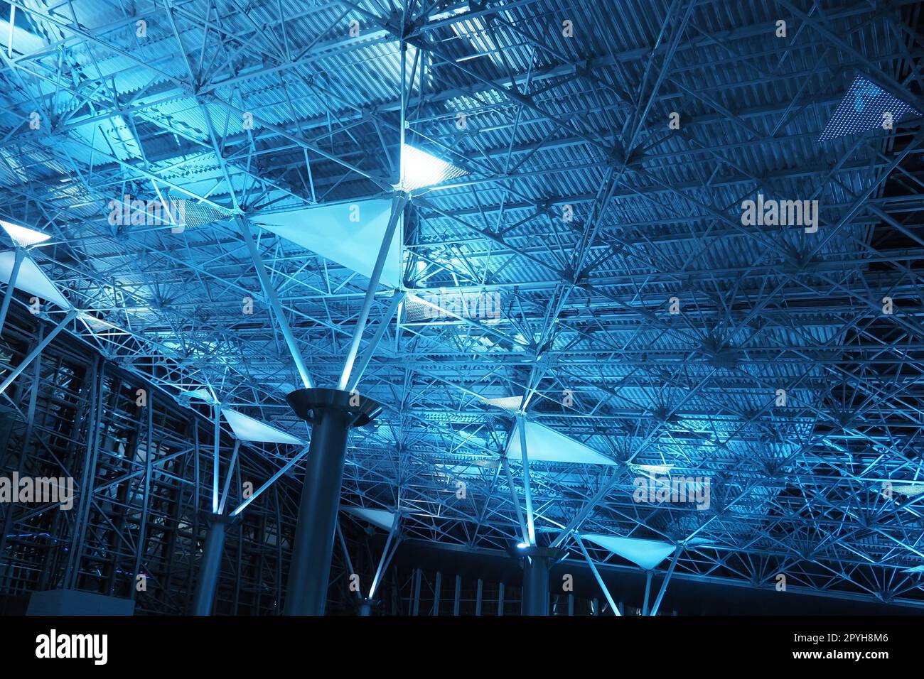 Metal structures under the ceiling. Decorative details of the airport ...