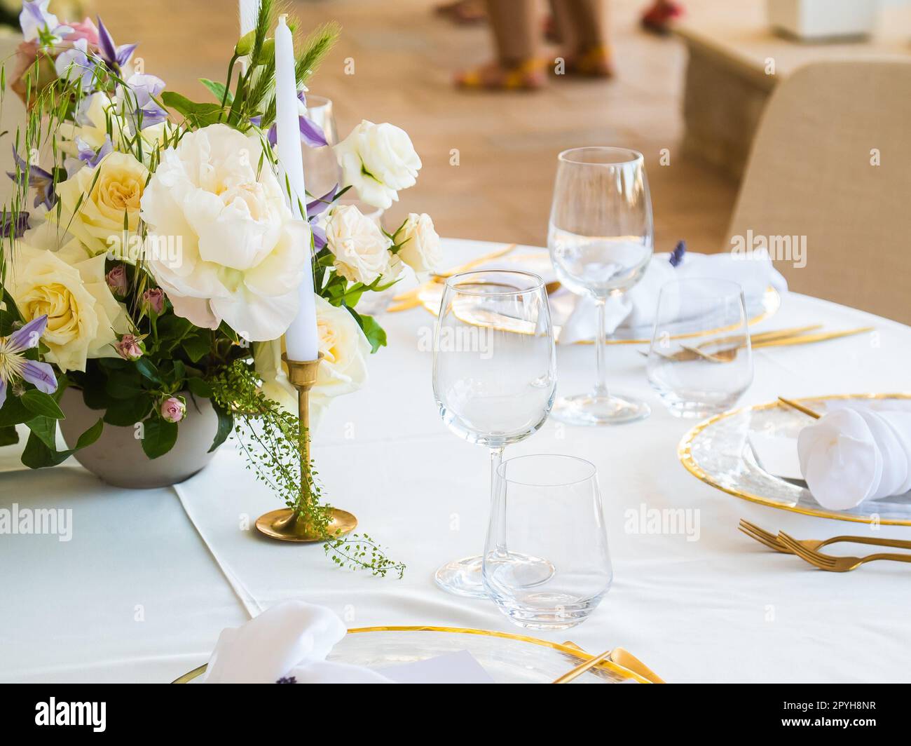 Table at luxury wedding reception event. Beautiful flowers on table and ...