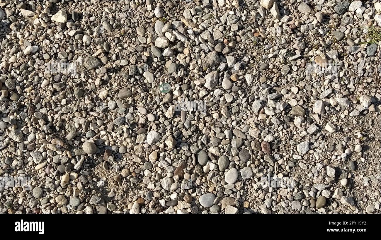 Grey stones background. gray stones. Small and large crushed stone ...