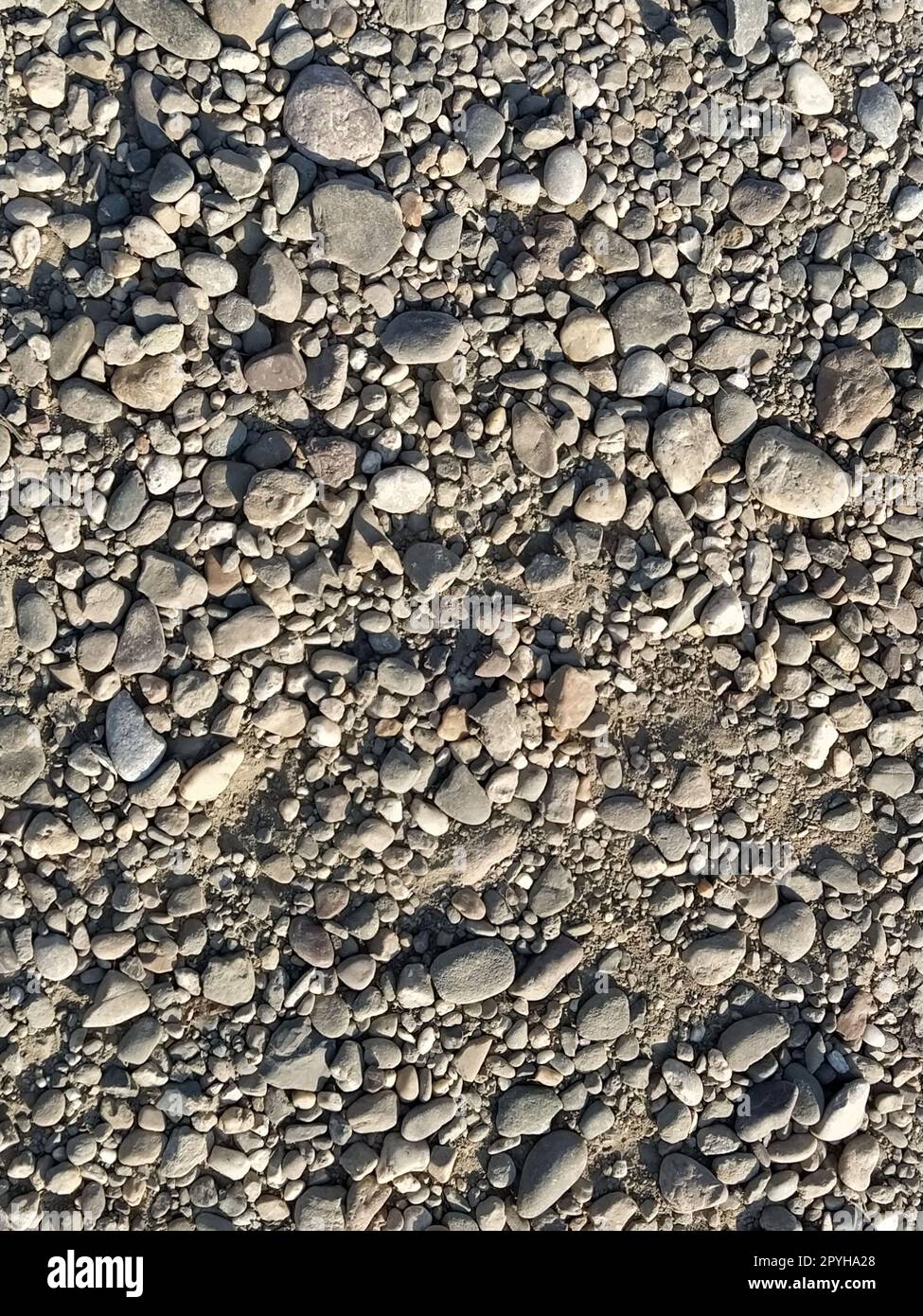Grey stones background. gray stones. Small and large crushed stone ...
