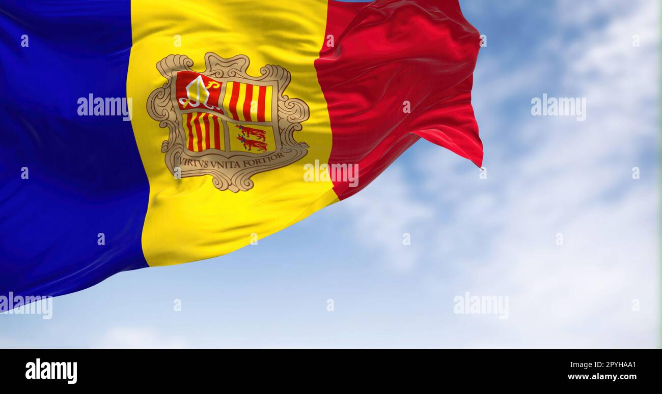 The flag of the Principality of Andorra waving in the wind on a clear ...