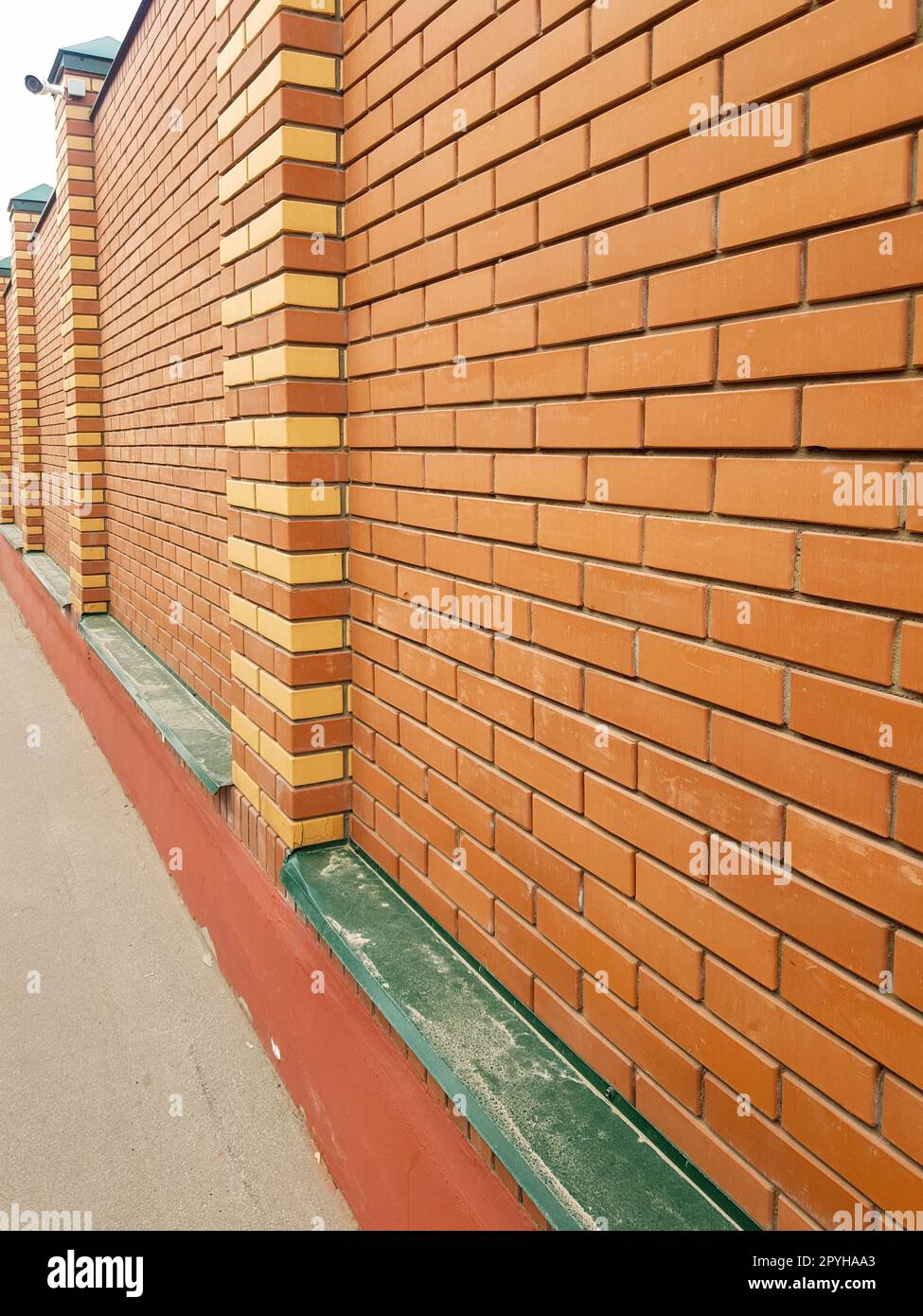 Security camera outside on a modern brick wall Stock Photo - Alamy