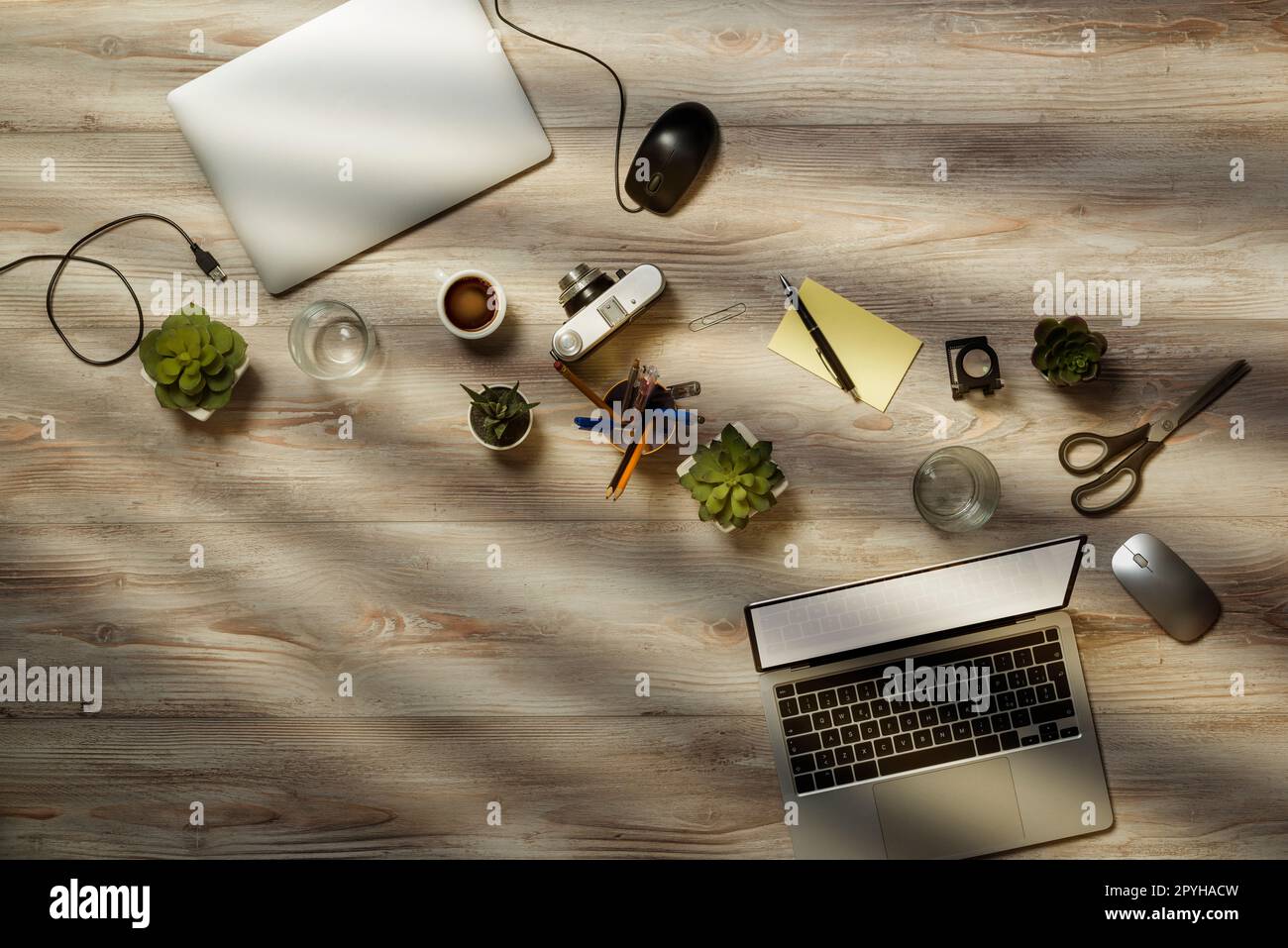 office table with laptop Stock Photo - Alamy