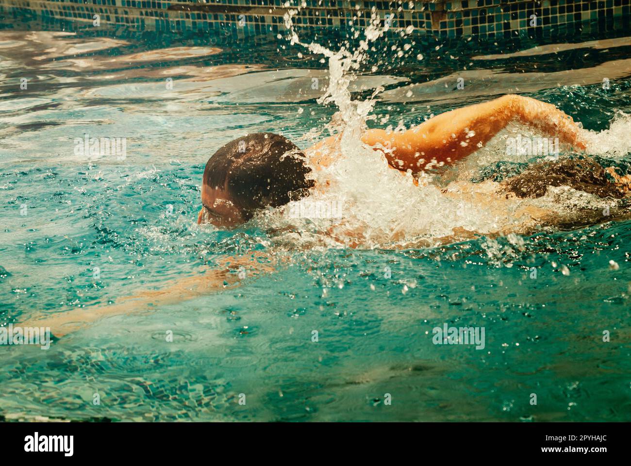 Young man swimmer train swimming in swimming pool Stock Photo - Alamy