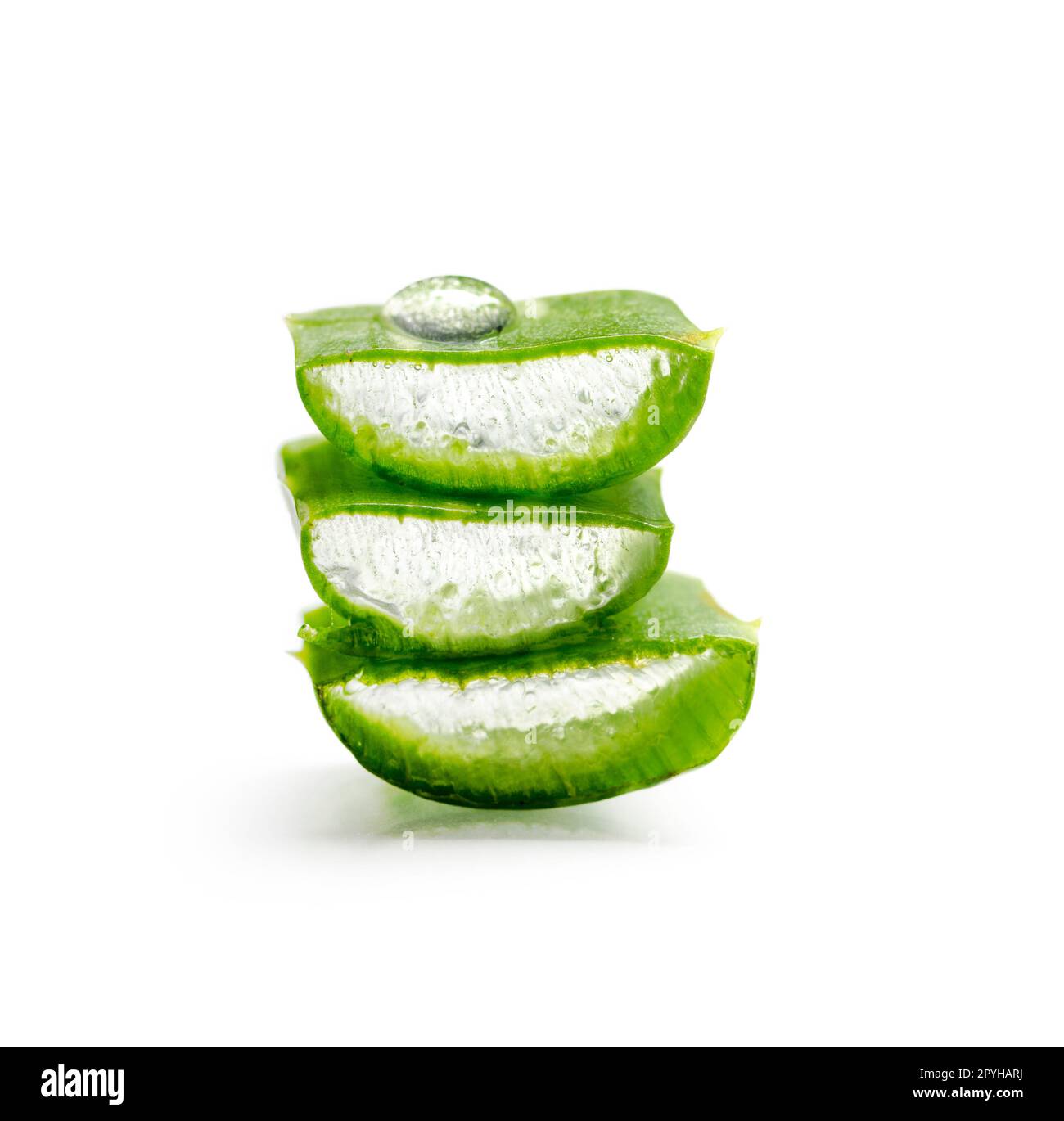 Closeup of aloe vera slices with water drop isolated over white ...