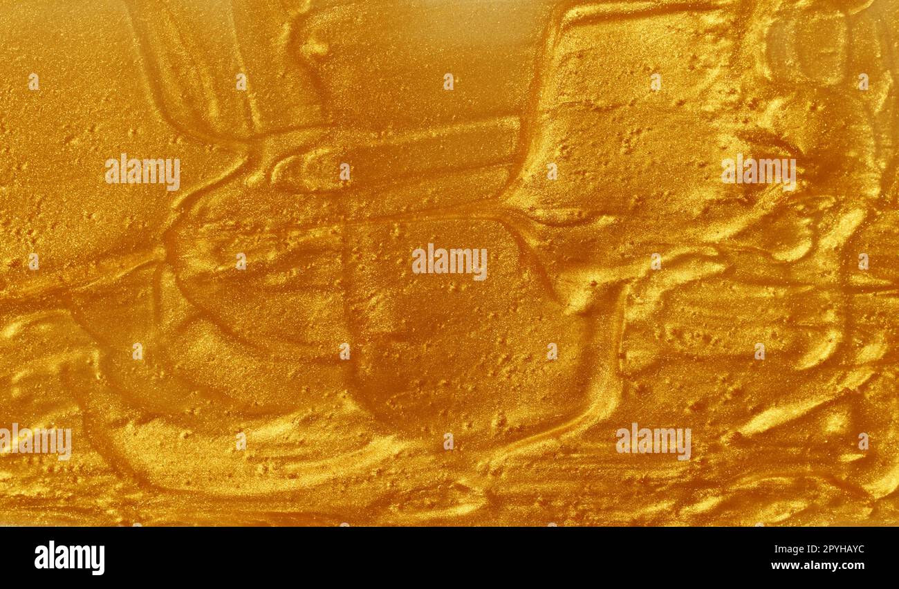 Sample of golden glitter gel with small particles, texture of ...