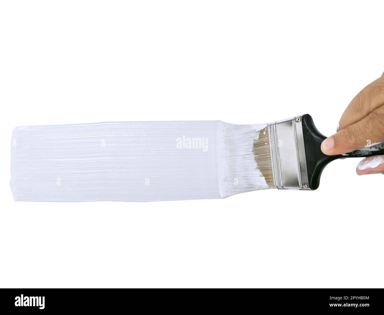 Hand holding brush painting wall Stock Photo - Alamy