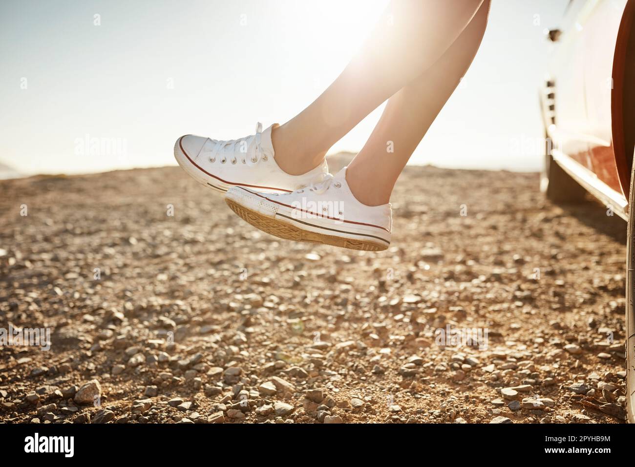 Its time to get away. a womans legs hanging off the side of a car while ...