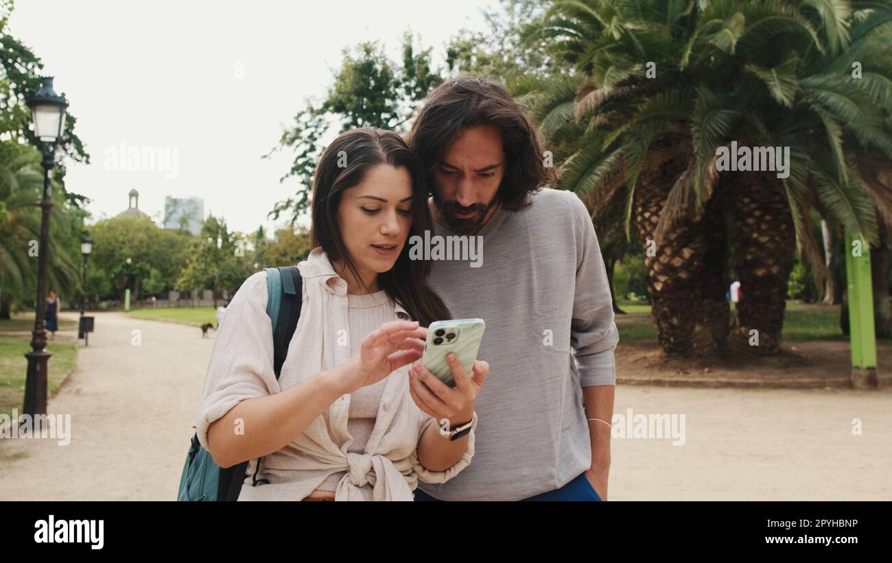 Young couple using map walking hi-res stock photography and images - Alamy