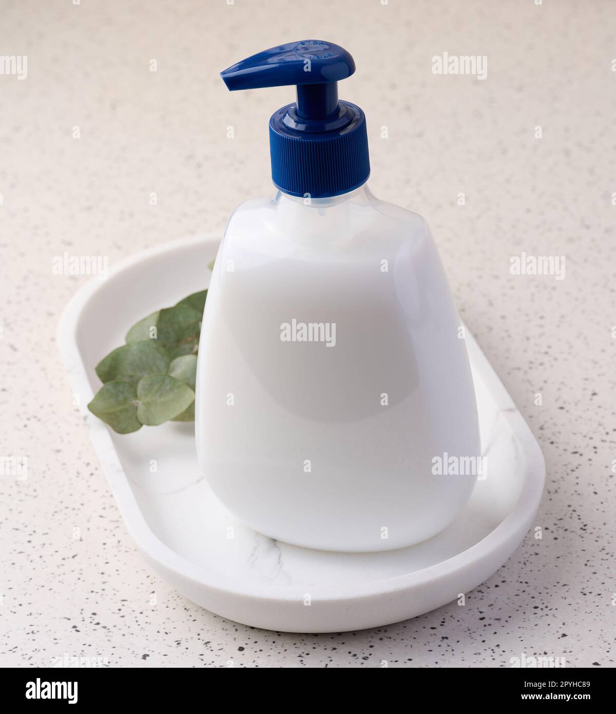 White plastic container with a pump for liquid products. Container for ...