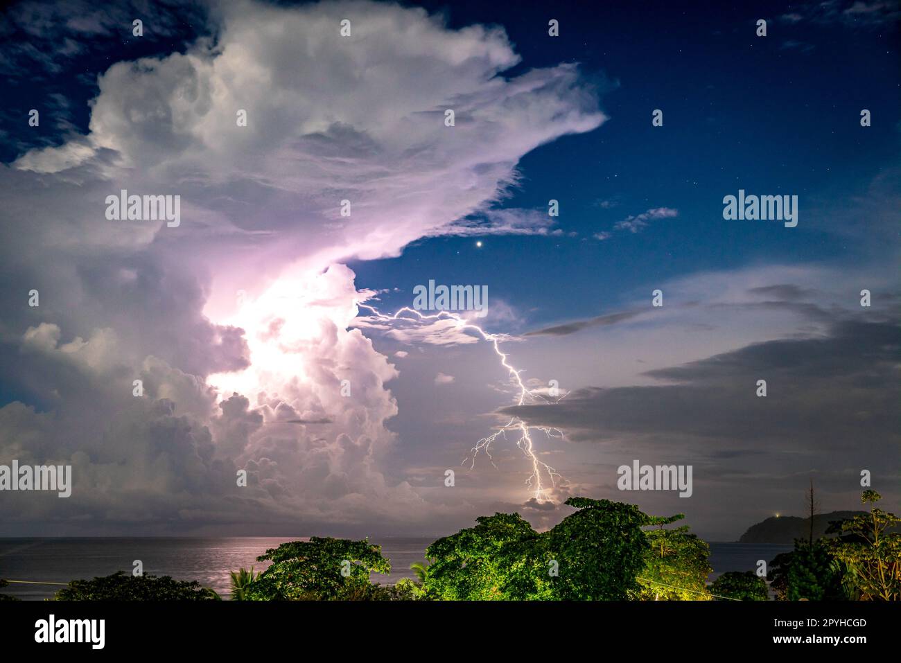 Amazing sunset over the stormy sea thunder and lightning in the ...