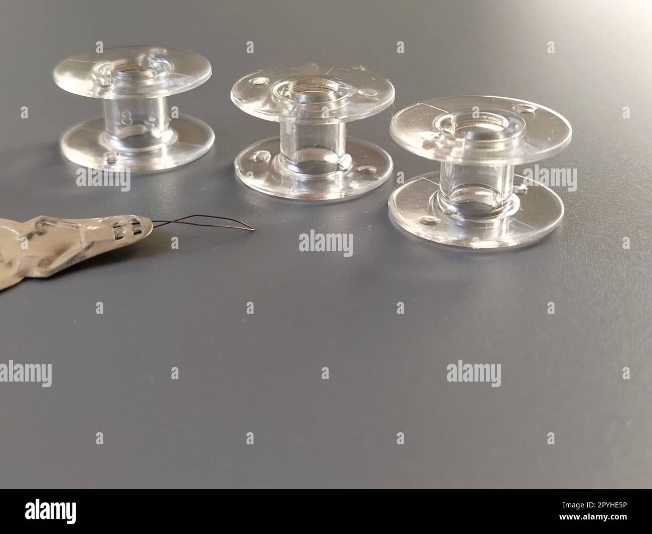 Buttonhole for automatically threading the sewing machine needle. Three ...