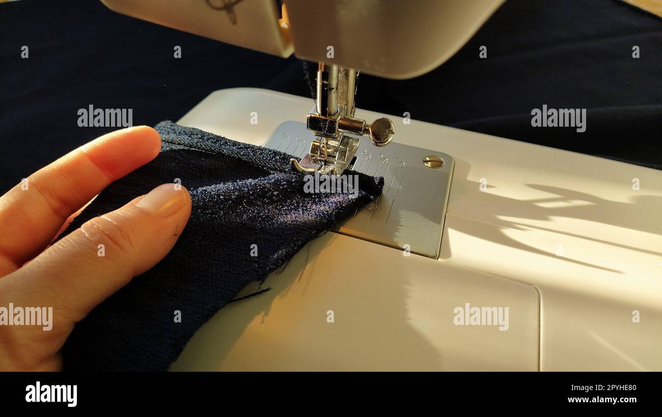 Sewing process on a modern sewing machine, close-up. Sewing machine ...