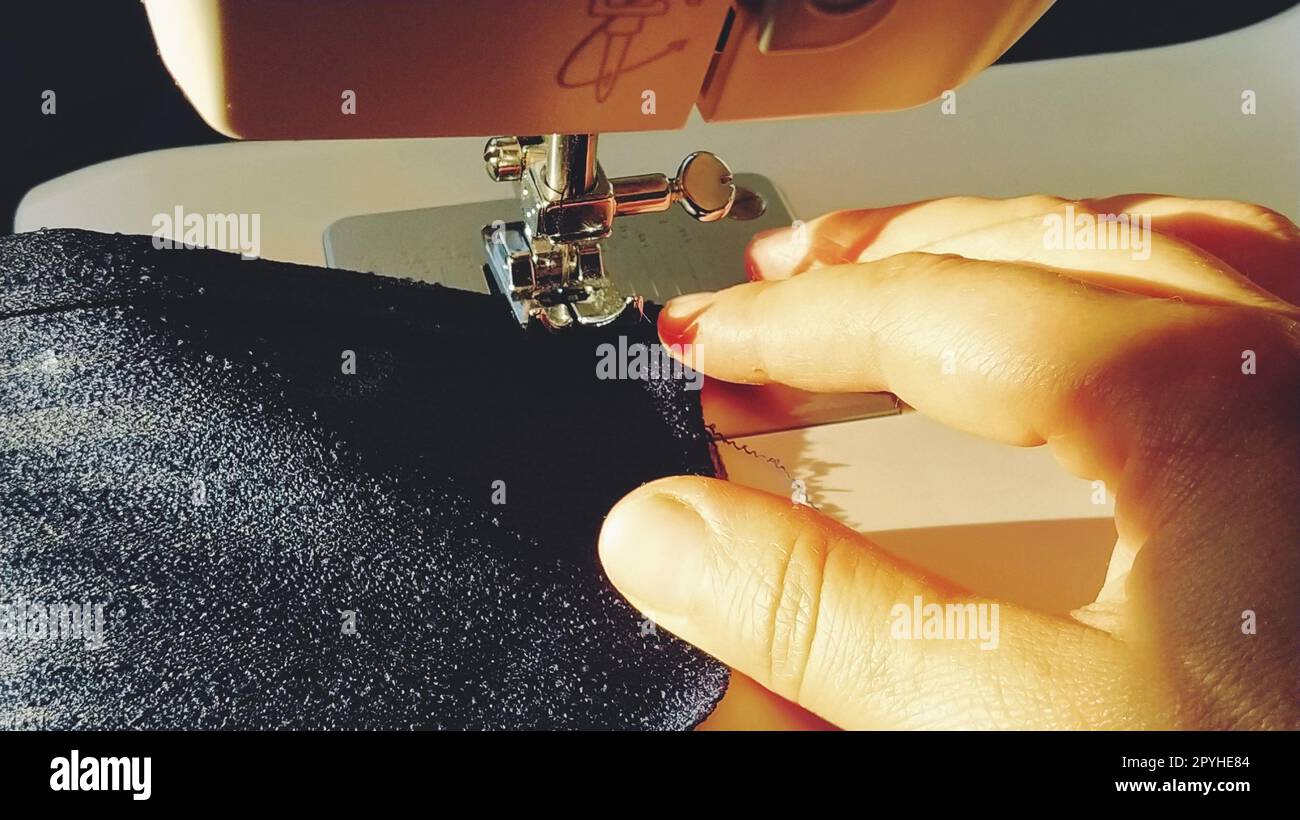 Sewing process on a modern sewing machine, close-up. Sewing machine ...