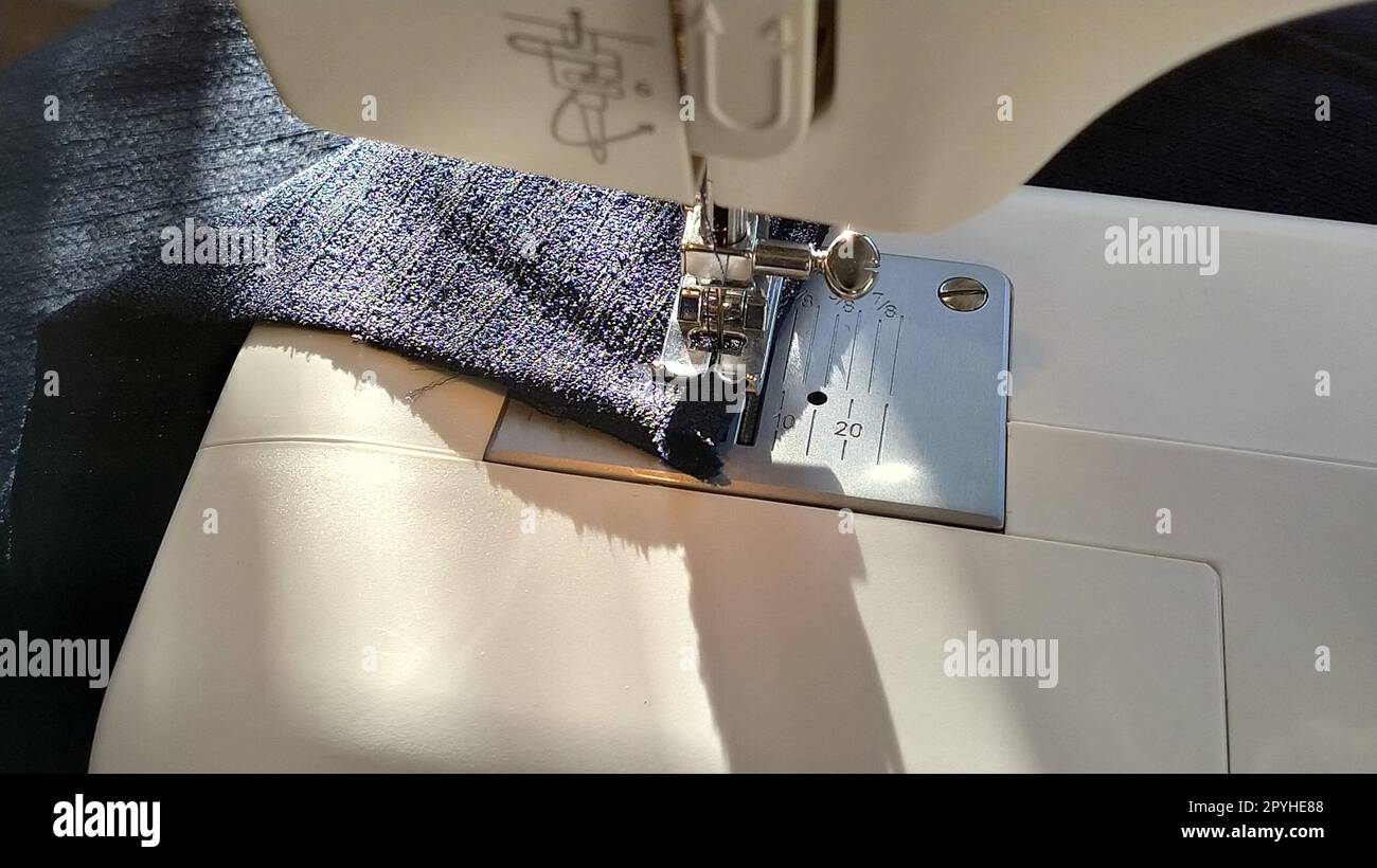 Sewing process on a modern sewing machine, close-up. Sewing machine ...