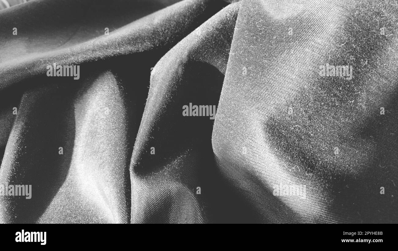 black fabric with interlacing threads close-up. Black and white ...