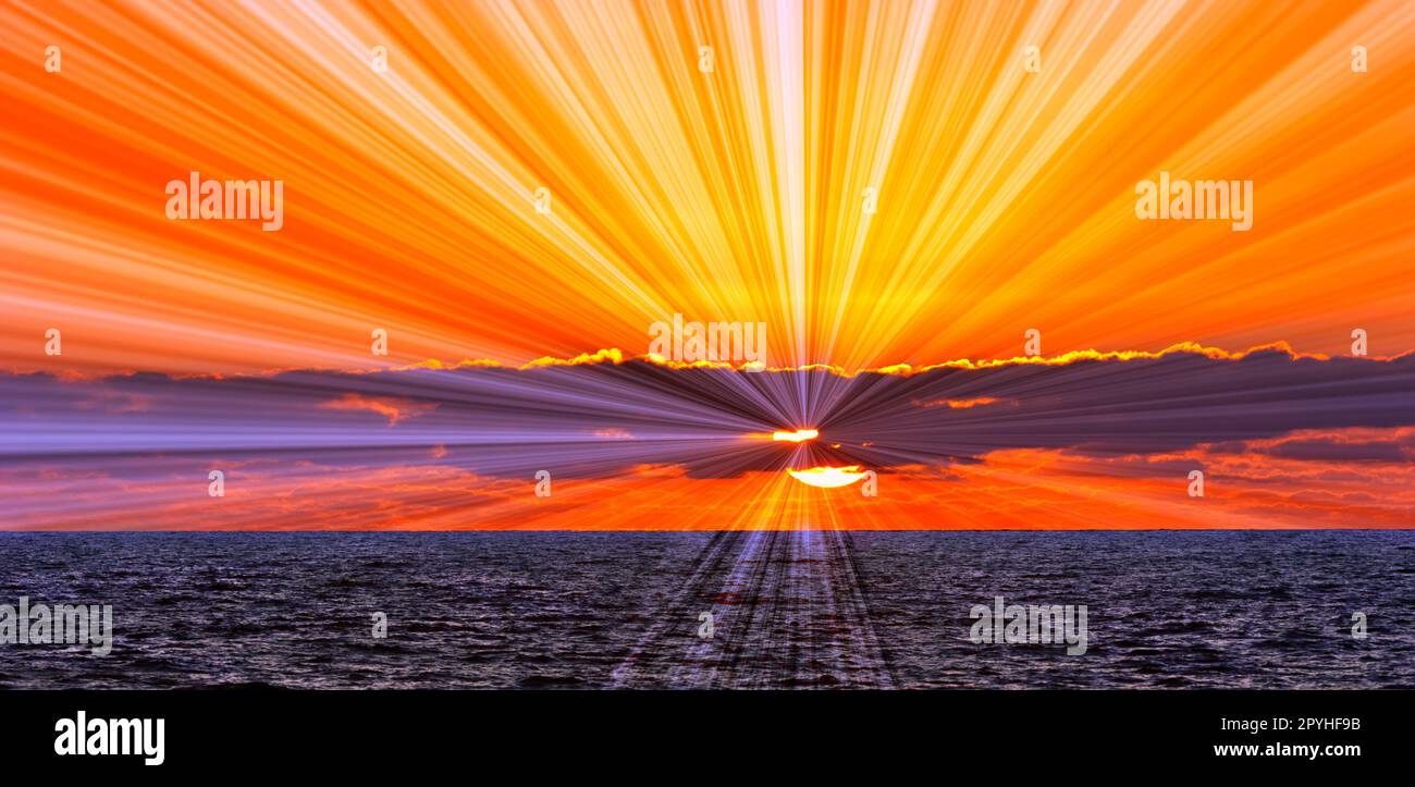 An Ocean Sunset With Sun Rays Emanating From Behind The Clouds ...