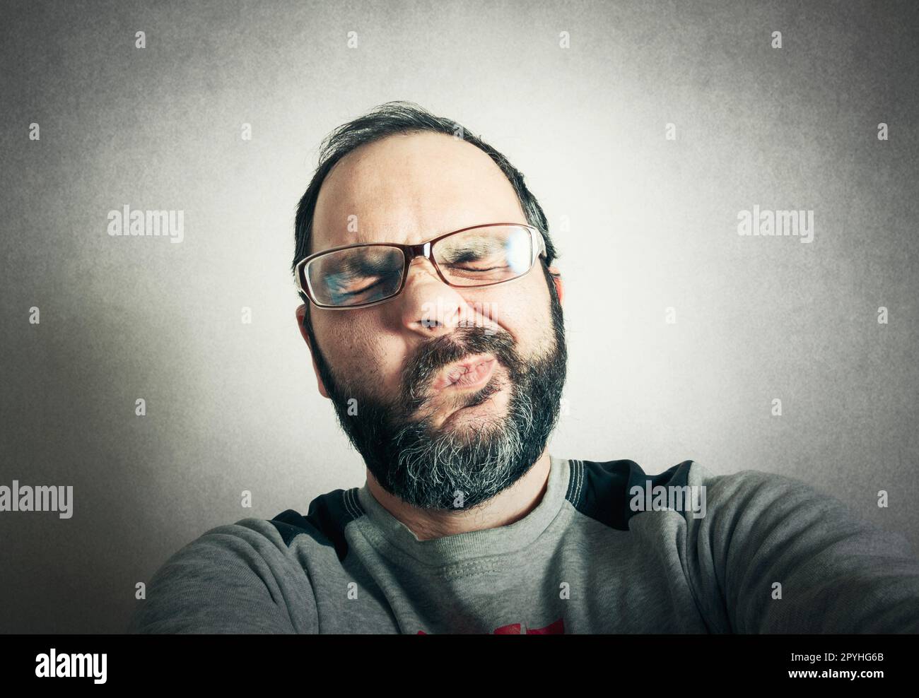 Funny man with the beard making expressions Stock Photo - Alamy