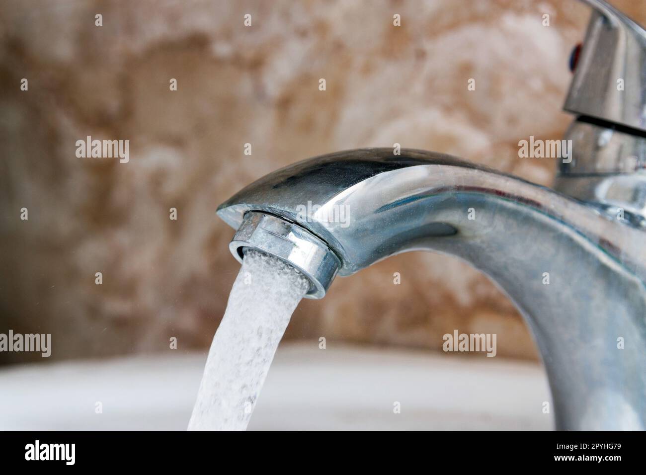 Closeup of the flowing water from the tap Stock Photo - Alamy