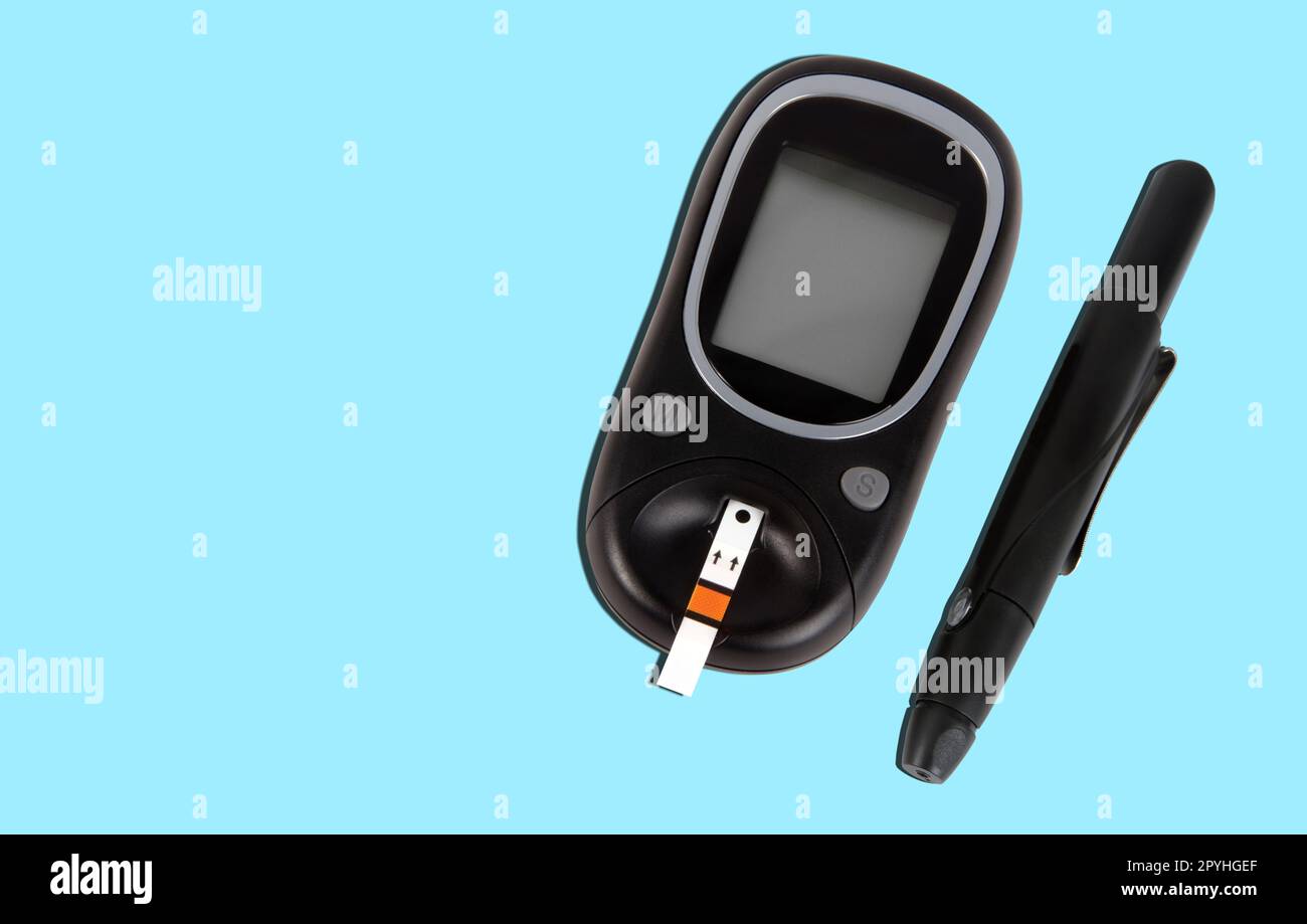 Sugar glucometer on the blue Stock Photo - Alamy