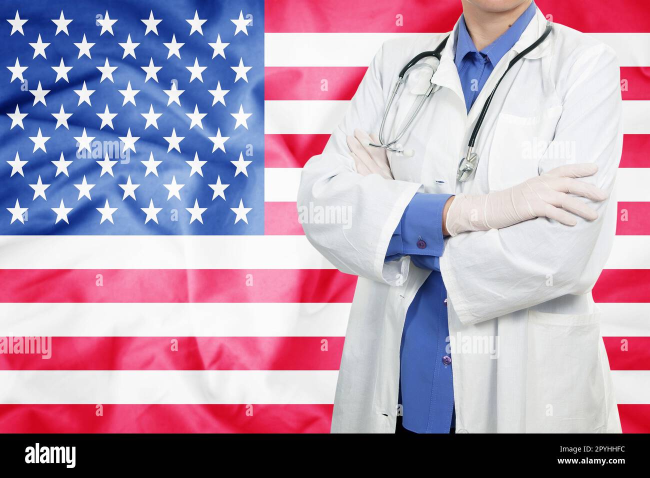 Doctor standing with the flag Stock Photo - Alamy