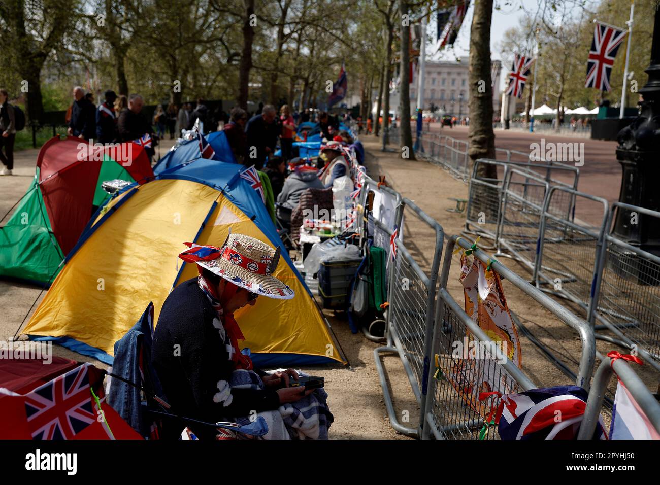 People set up tents along the Royal Procession route in Central London ...