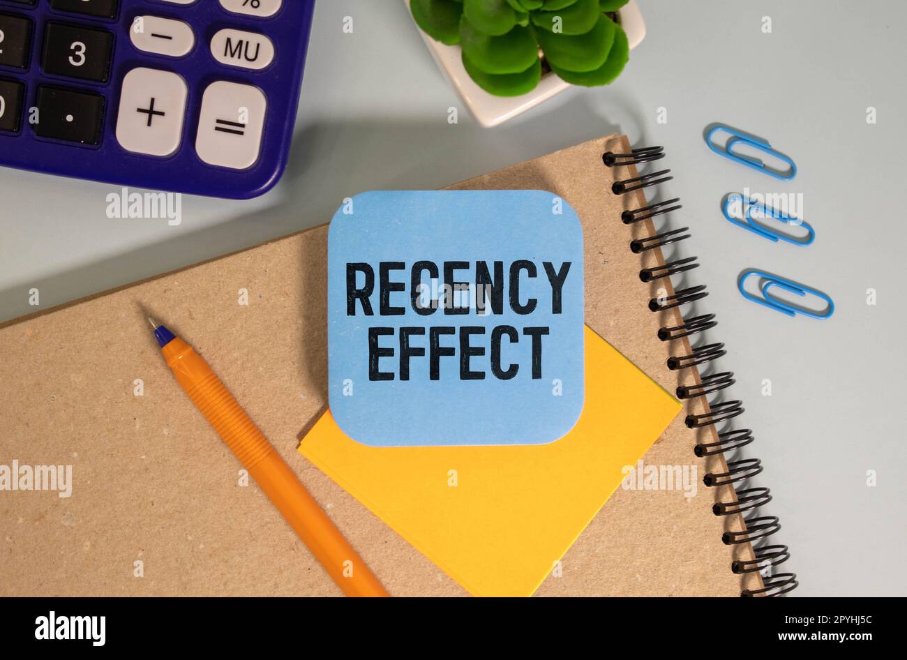 Notepad with the text Recency effect and the graph on desk. Memory and ...