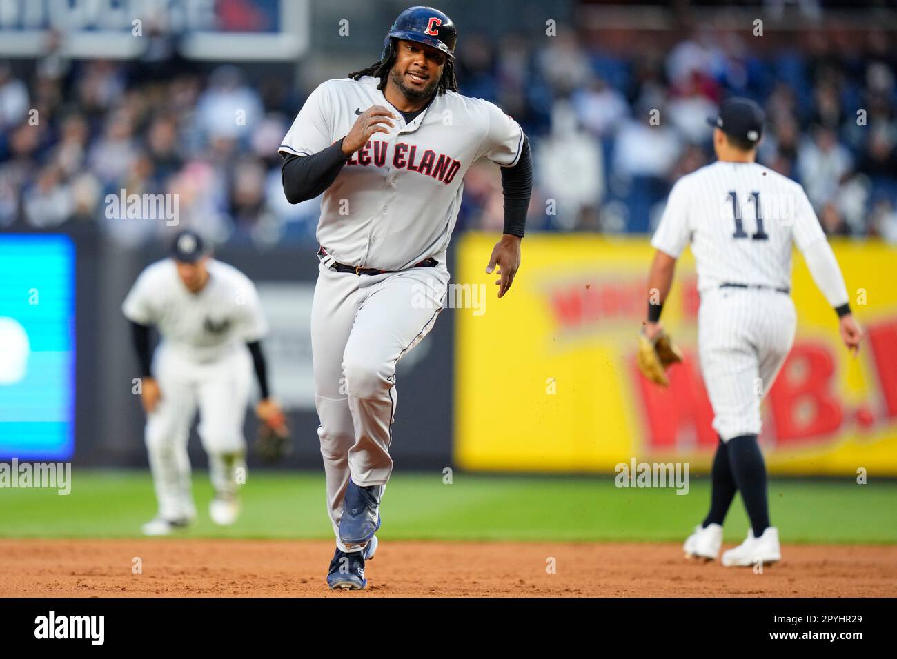 Cleveland Guardians' Josh Bell runs to third base on an RBI single by ...