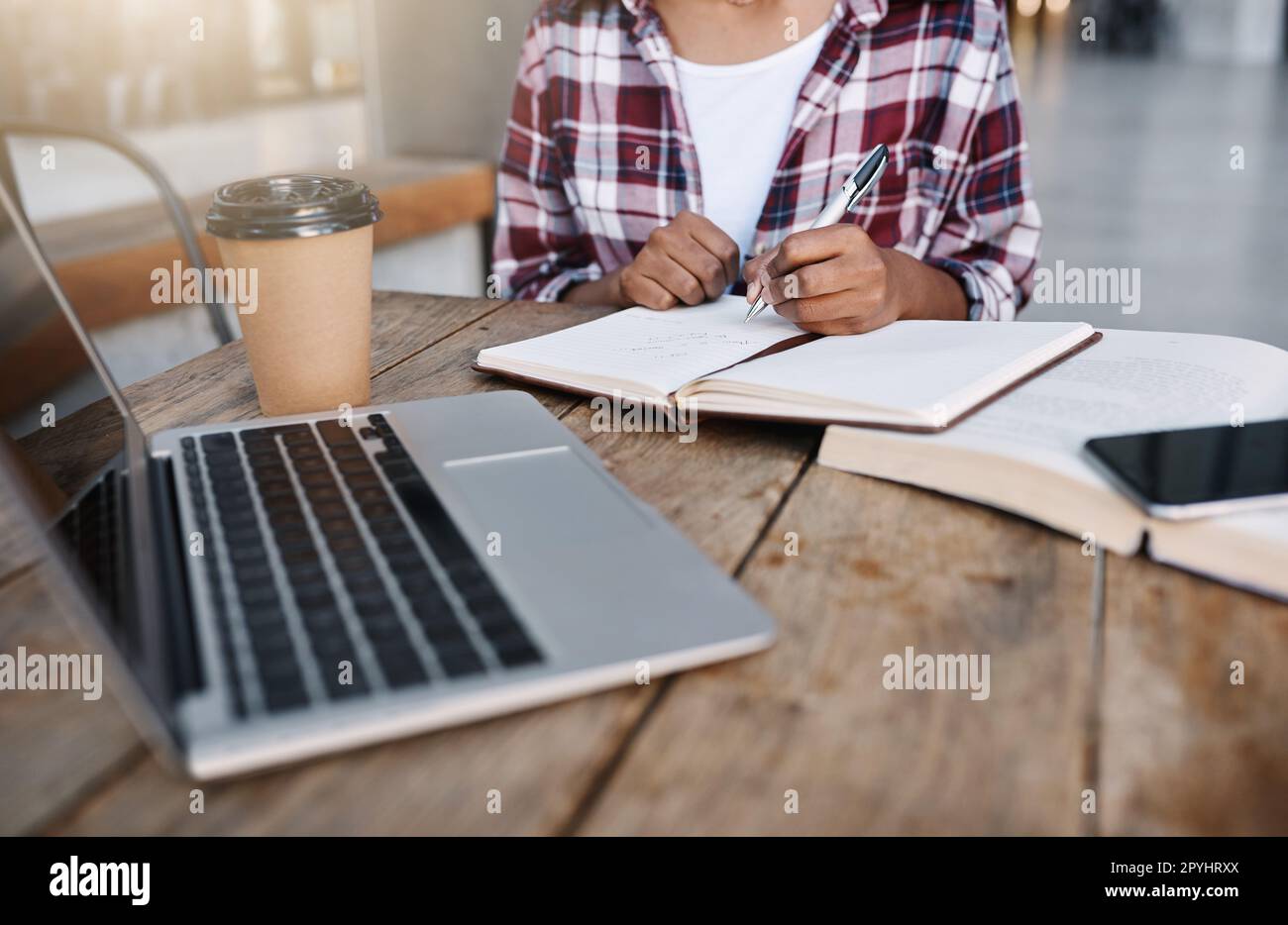 Making notes while studying for finals. an unrecognizable female ...
