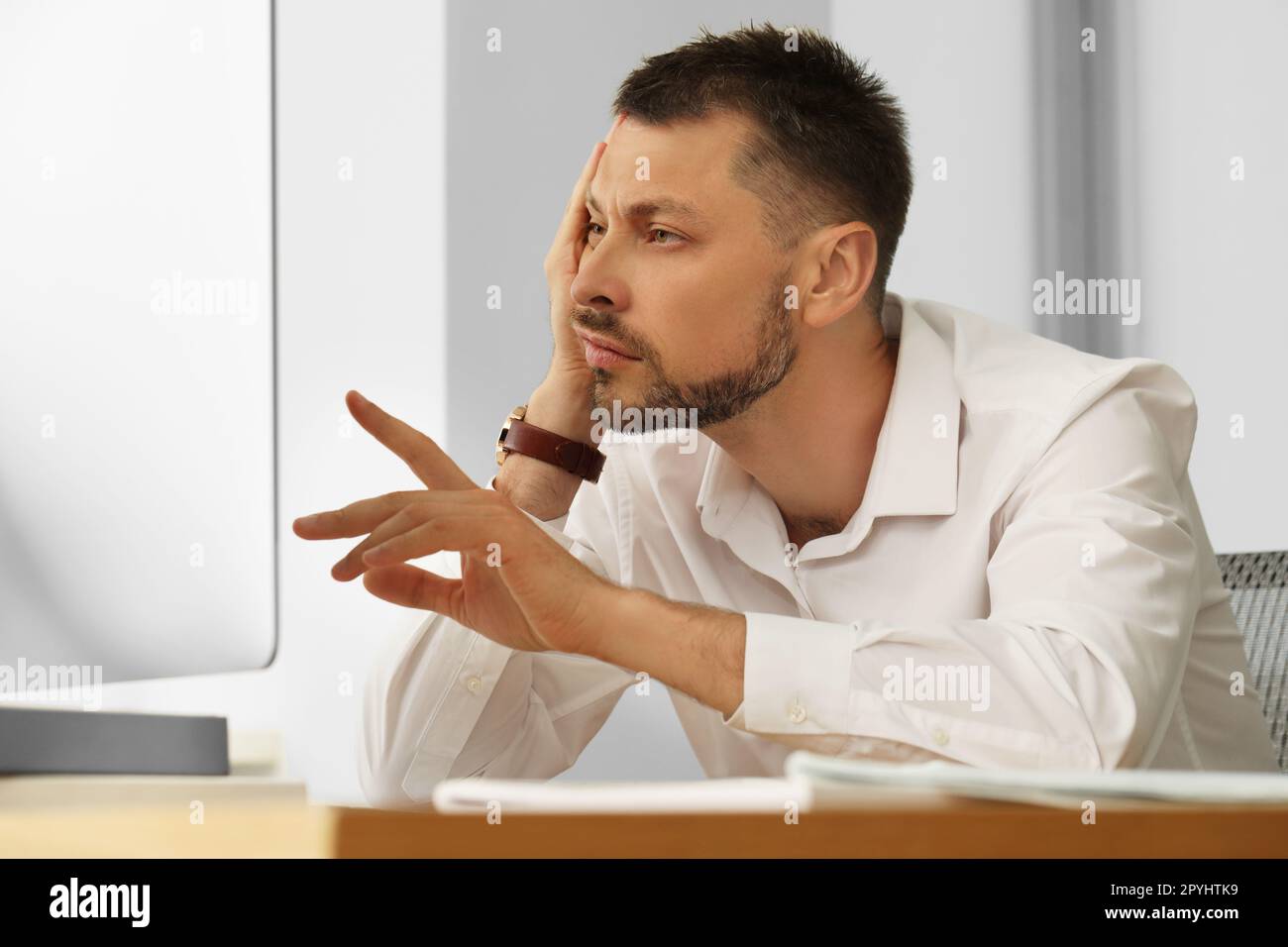 Sleep deprived man at workplace in office Stock Photo - Alamy