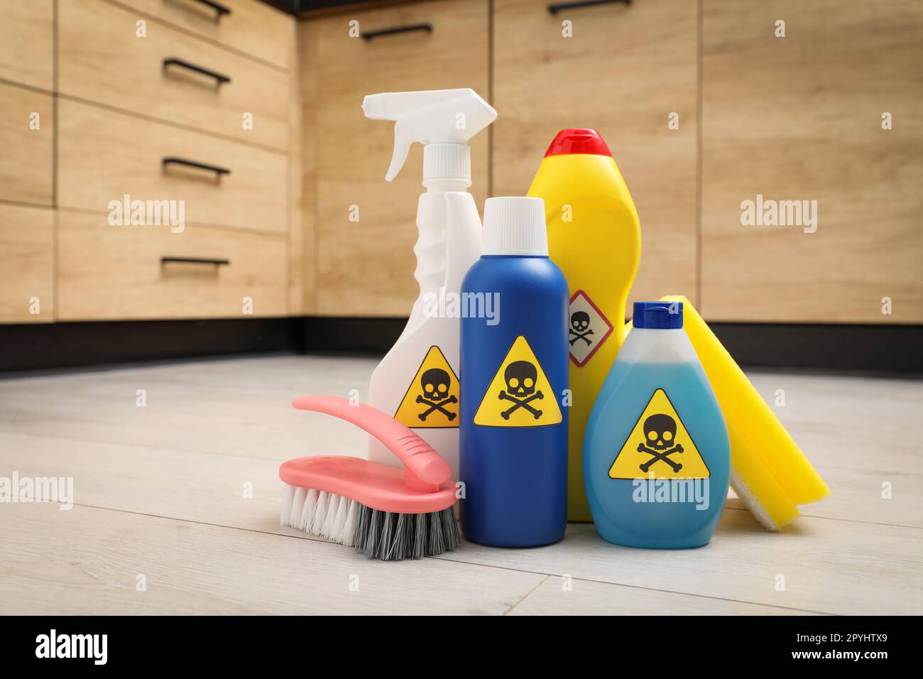 Bottles of toxic household chemicals with warning signs, scouring ...