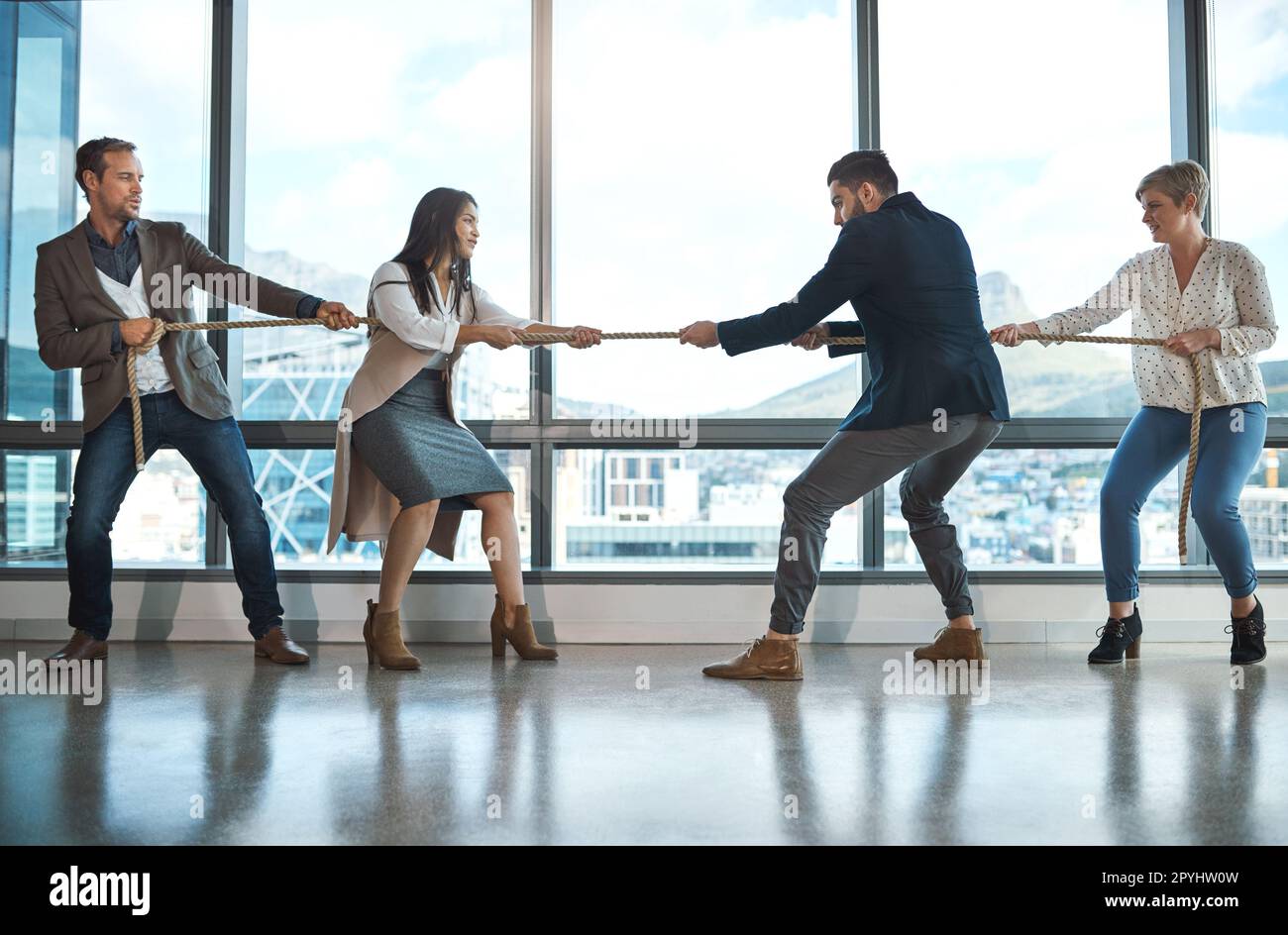 Take matters into your own hands. a group of businesspeople pulling on ...